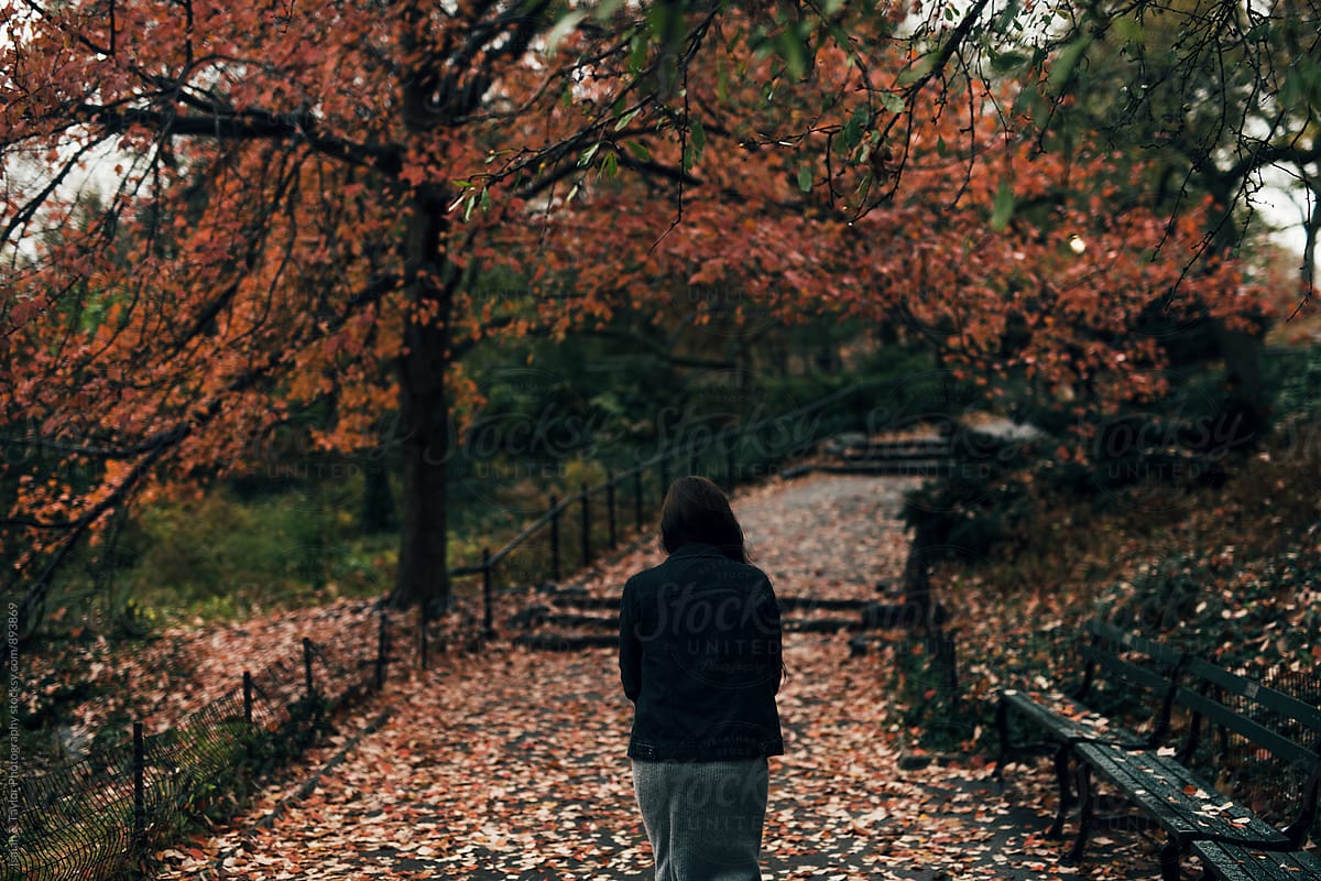 "Woman Standing Alone In Park" by Stocksy Contributor "Itla" - Stocksy