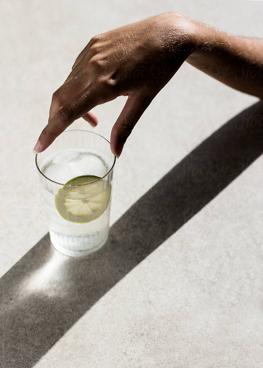 "The Hand And The Glass" by Stocksy Contributor "Carmen Palma" - Stocksy