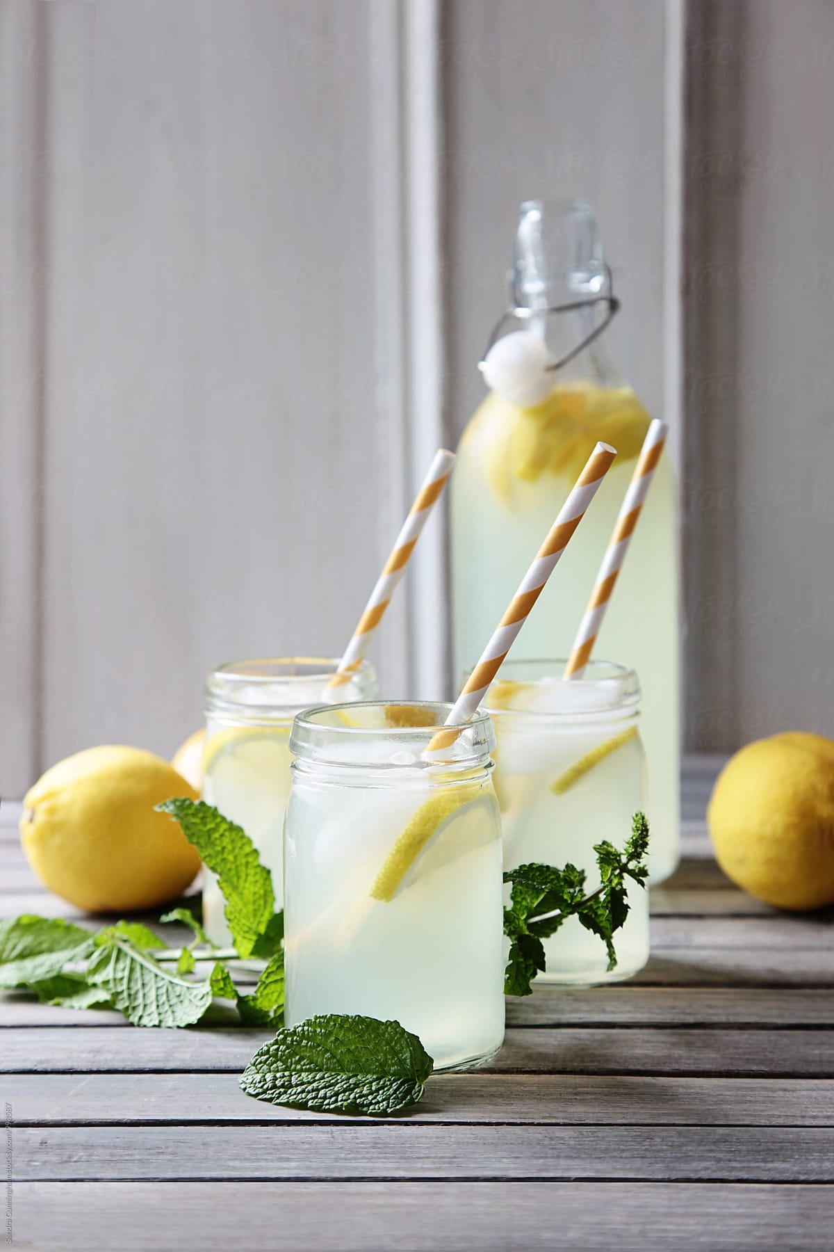 Glasses of homemade lemonade with mint on table - Stock Image - Everypixel