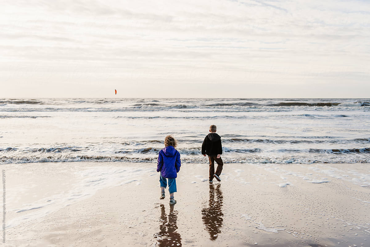 "2 Kids Walking On The Beach During Sunset" by Stocksy Contributor ...