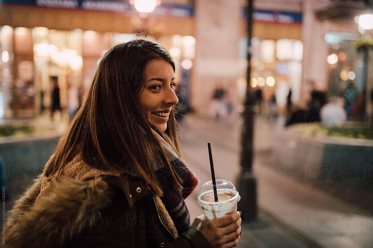 "Beautiful Young Woman With Milkshake On The Street" by Stocksy ...