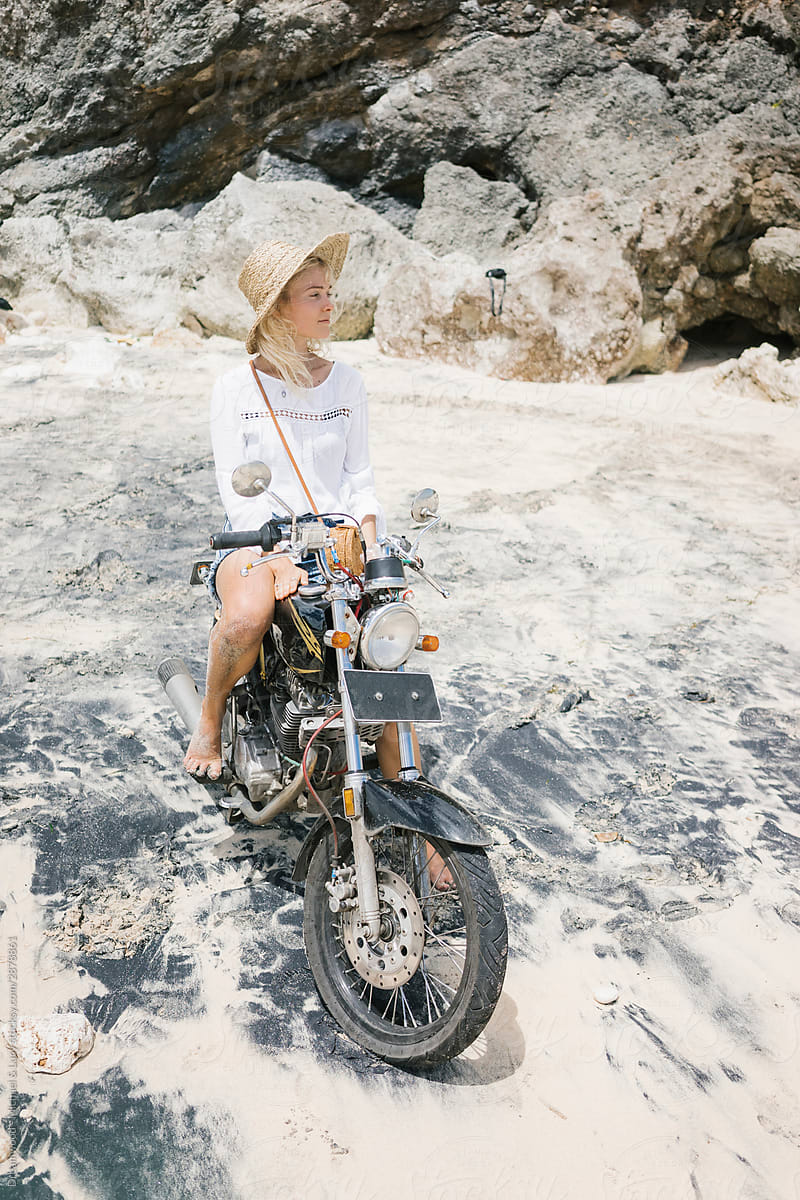 "Barefoot Woman Sitting On Motorbike On Sandy Slope" by Stocksy ...