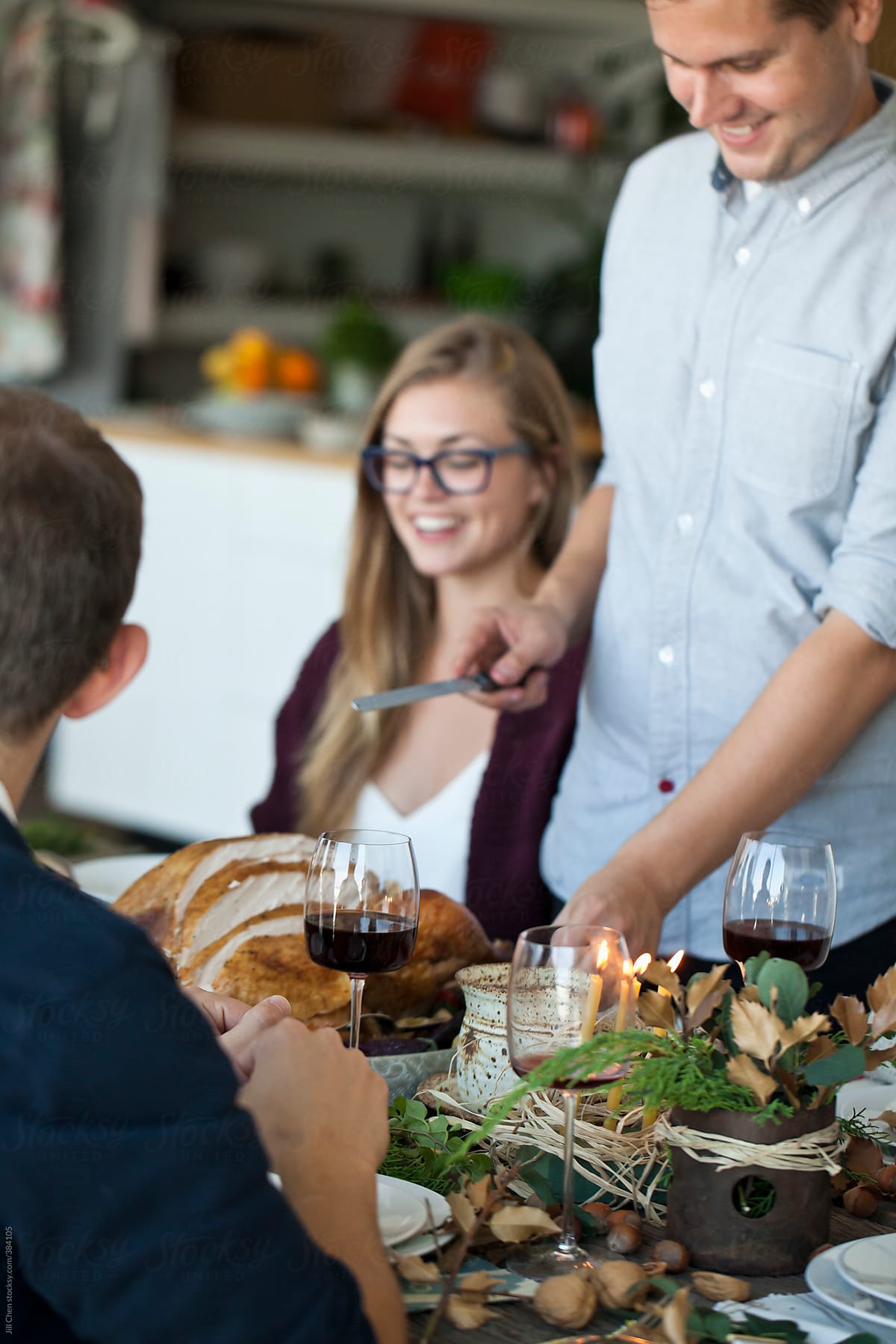 "Carving Turkey At Table" by Stocksy Contributor "Jill Chen" - Stocksy