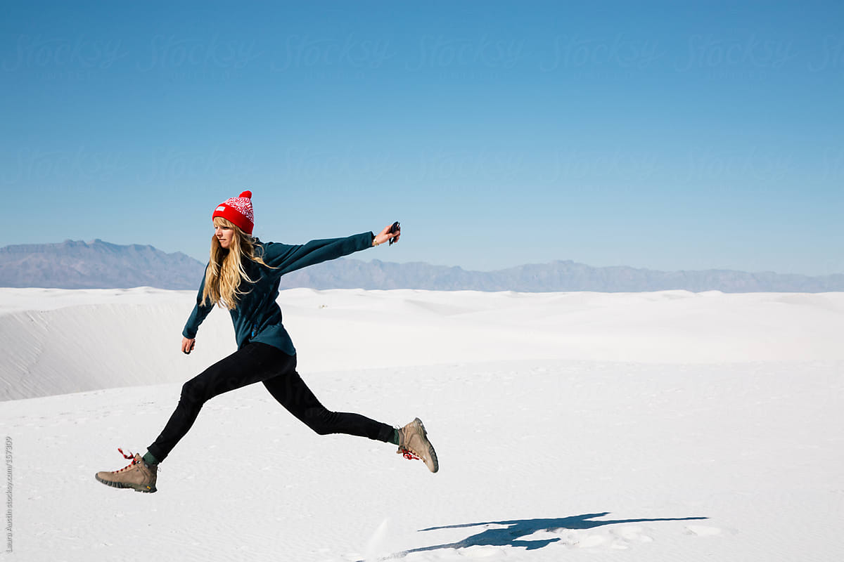 "Girl Jumping Through White Landscape" by Stocksy Contributor "Laura ...