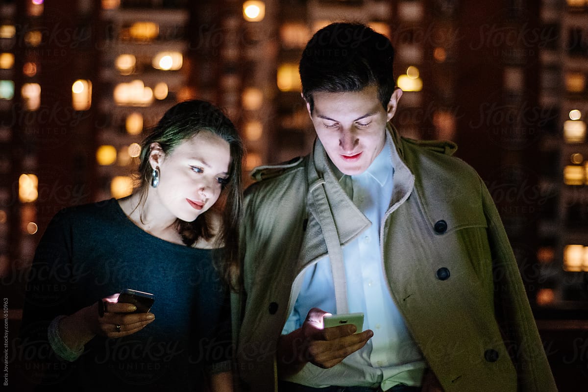 "Young Friends Using Mobile Phones On Rooftop" by Stocksy Contributor ...