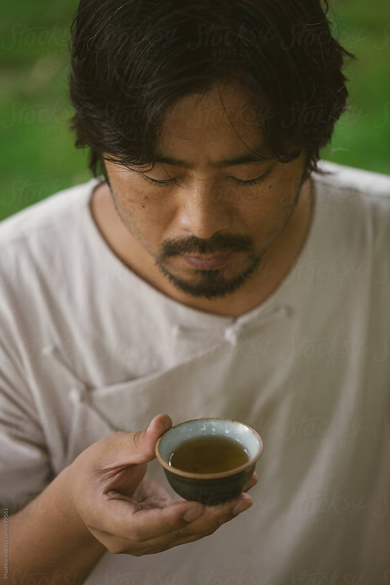 "Man Drinking Tea In A Garden" by Stocksy Contributor "MaaHoo" - Stocksy
