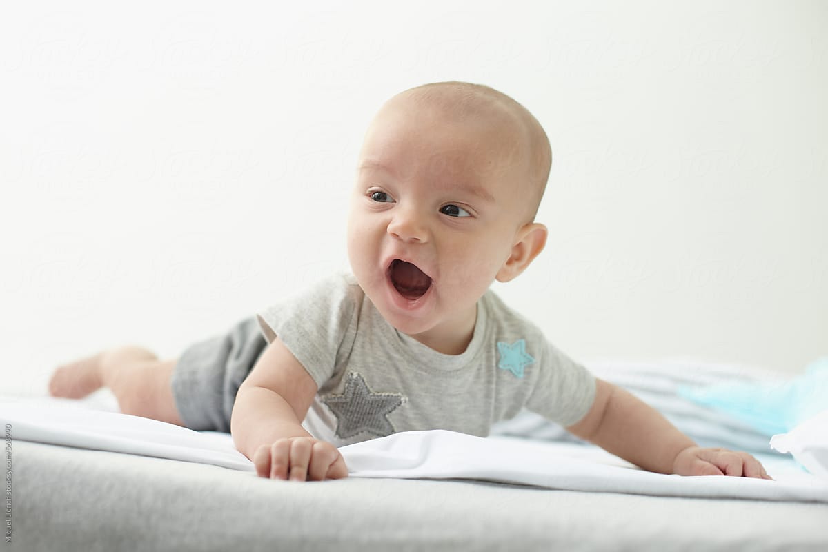 "Baby Expressing Happiness" by Stocksy Contributor "Miquel Llonch ...