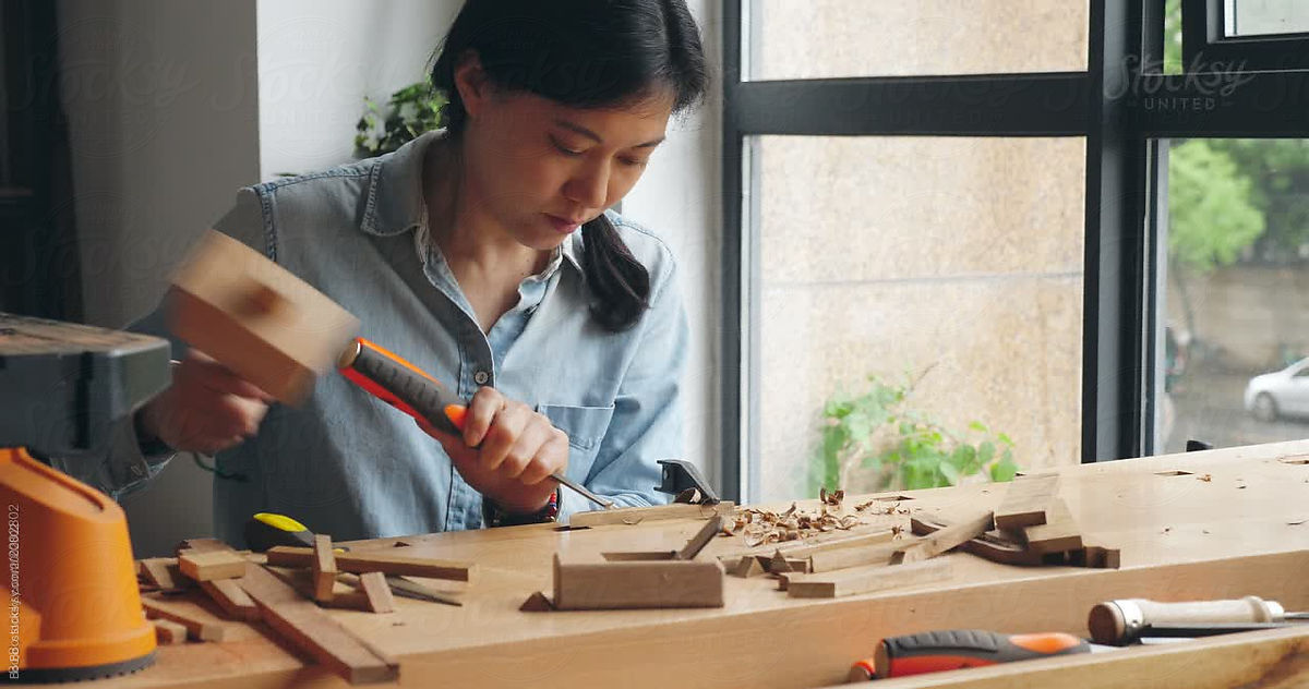 "Asian Female Carpenter Focus On Carving" by Stocksy Contributor "Bo Bo ...