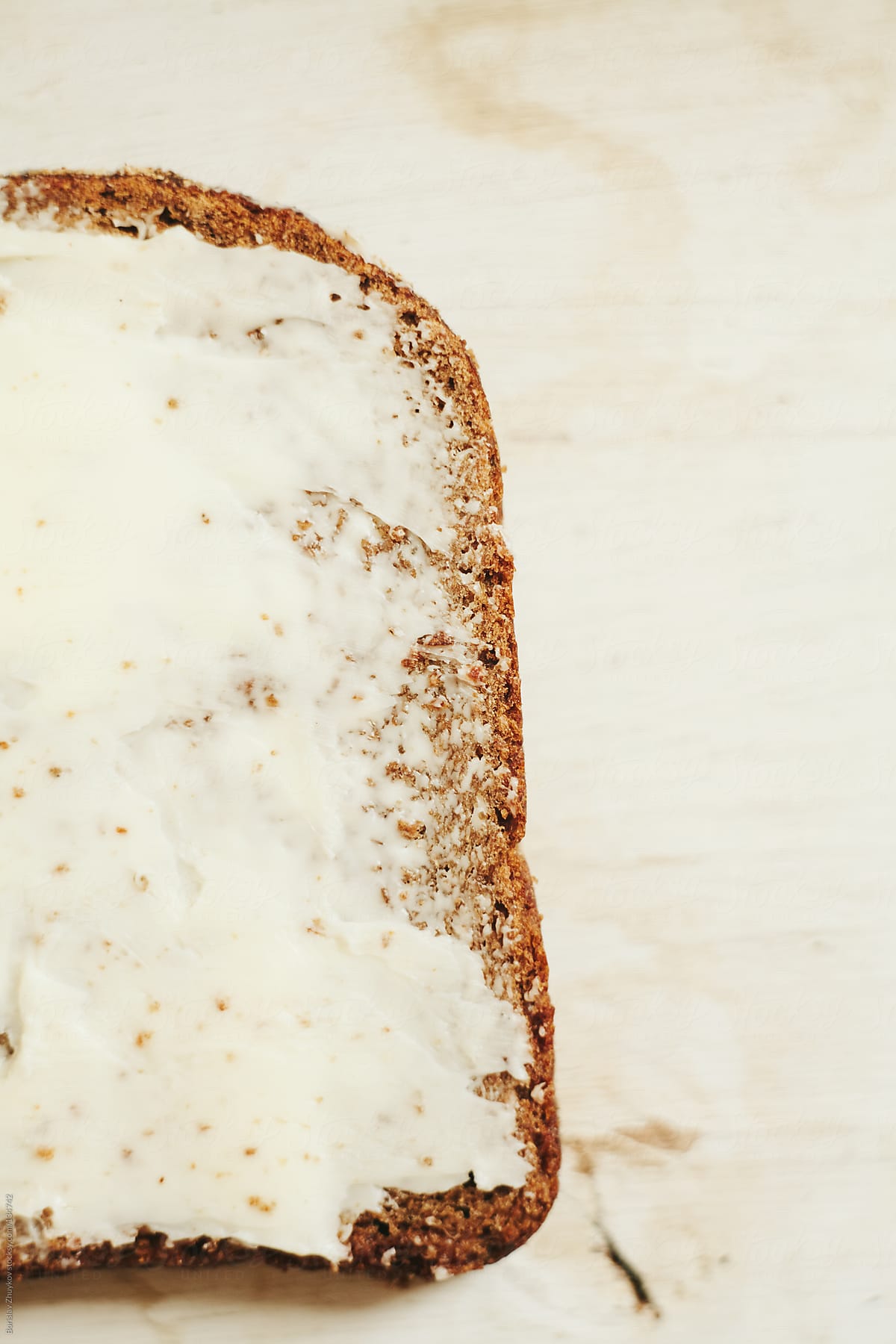 "Buttered Slice Of Rye Bread On A White Wooden Surface" by Stocksy ...