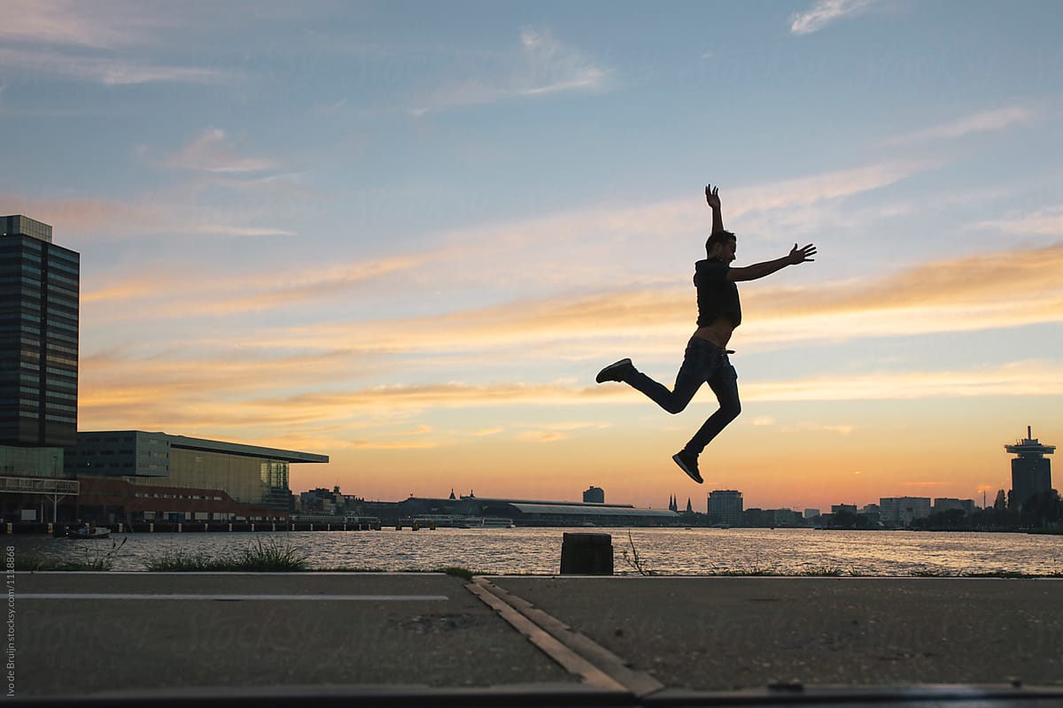 "Man Jumping At The Waterfront In Amsterdam" by Stocksy Contributor ...