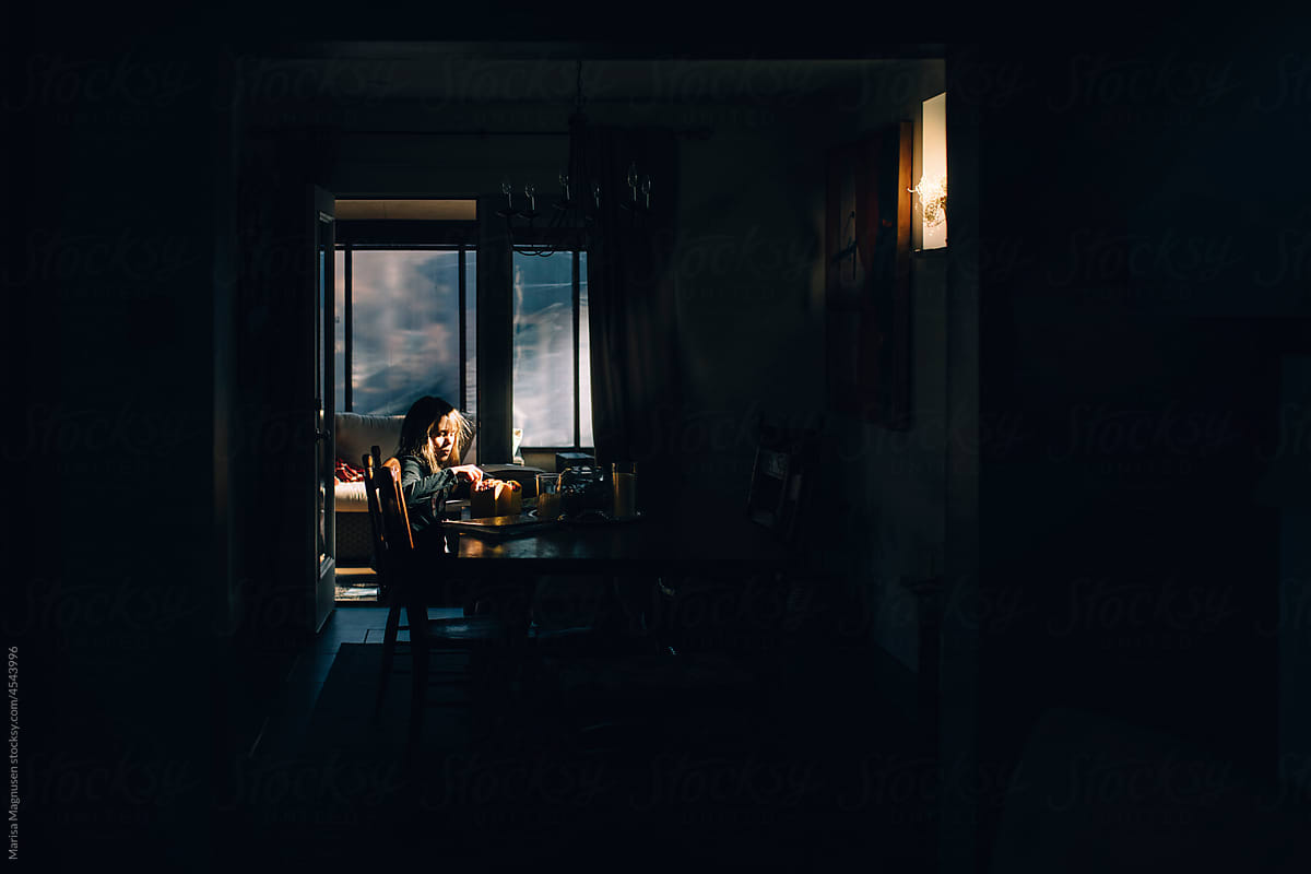 "Girl At Table In Ray Of Light" by Stocksy Contributor "Marisa Magnusen ...