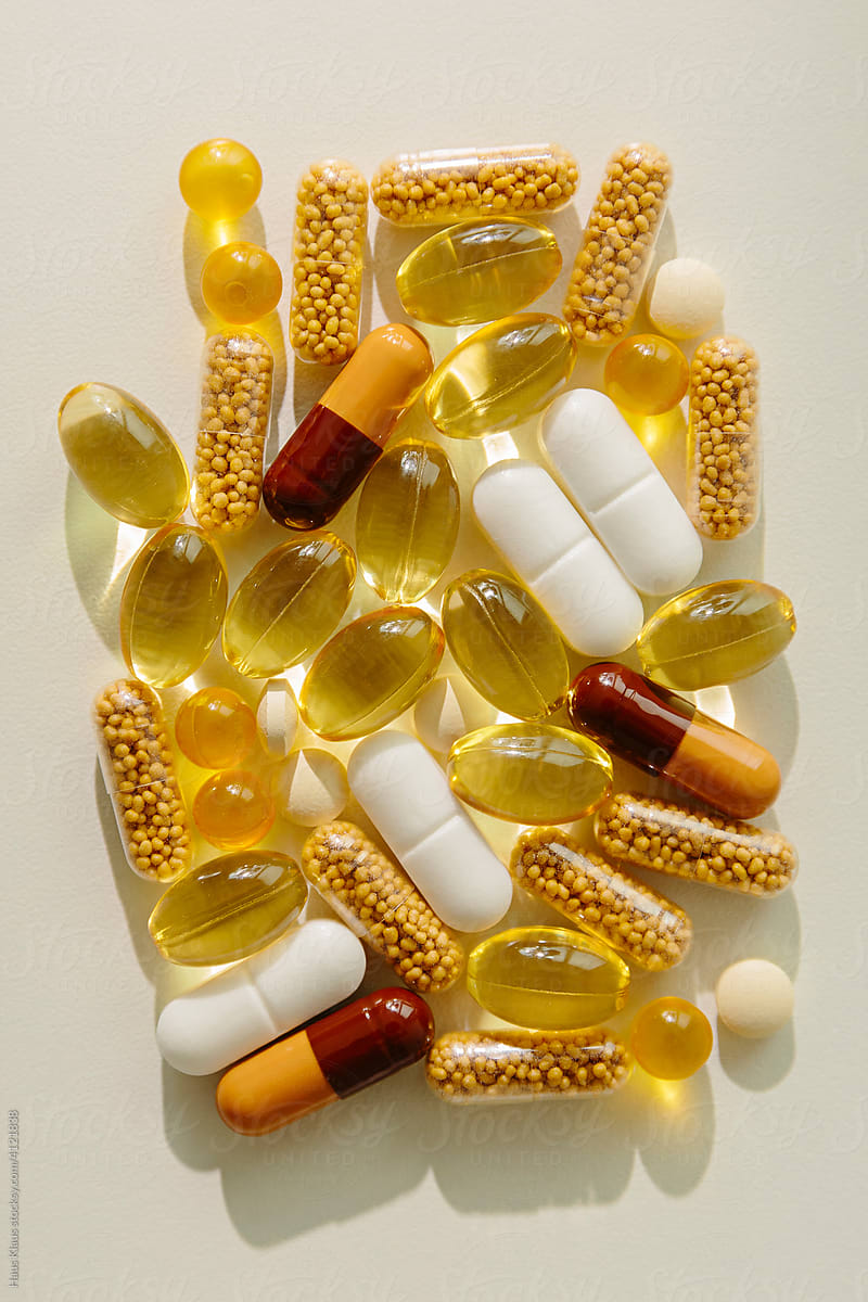 "Yellow Supplement Pills" by Stocksy Contributor "Haus Klaus" - Stocksy