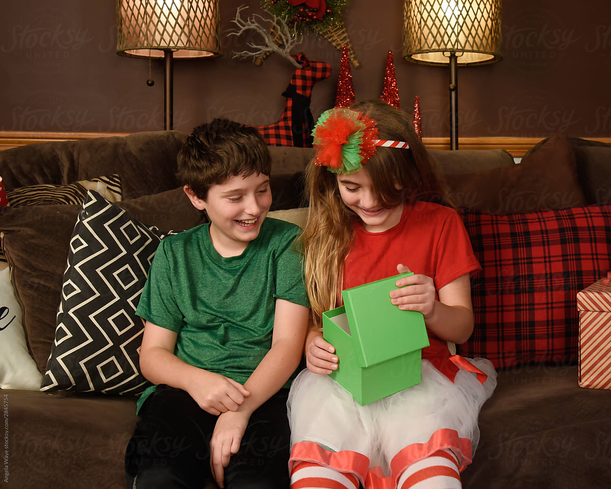 "Happy Children Opening Gift Surprise" by Stocksy Contributor "Angela ...