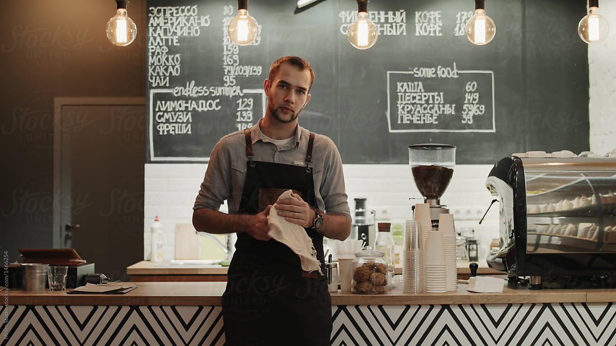 "Bartender Wiping Jug At Counter" by Stocksy Contributor "Milles Team ...