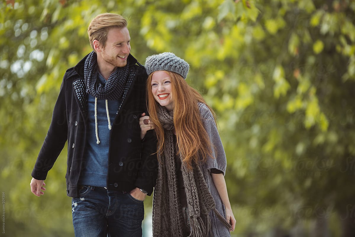 "Happy Couple Having A Walk" by Stocksy Contributor "Lumina" - Stocksy