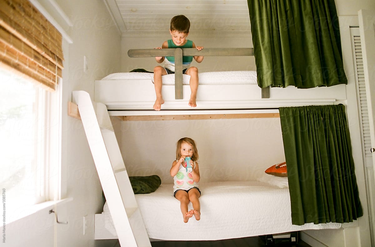 "Kids On Bunk Bed" by Stocksy Contributor "Maria Manco" - Stocksy