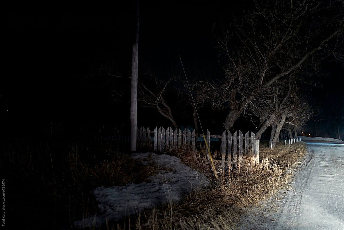 "An Old Fence At Night." by Stocksy Contributor "Todd Korol" - Stocksy
