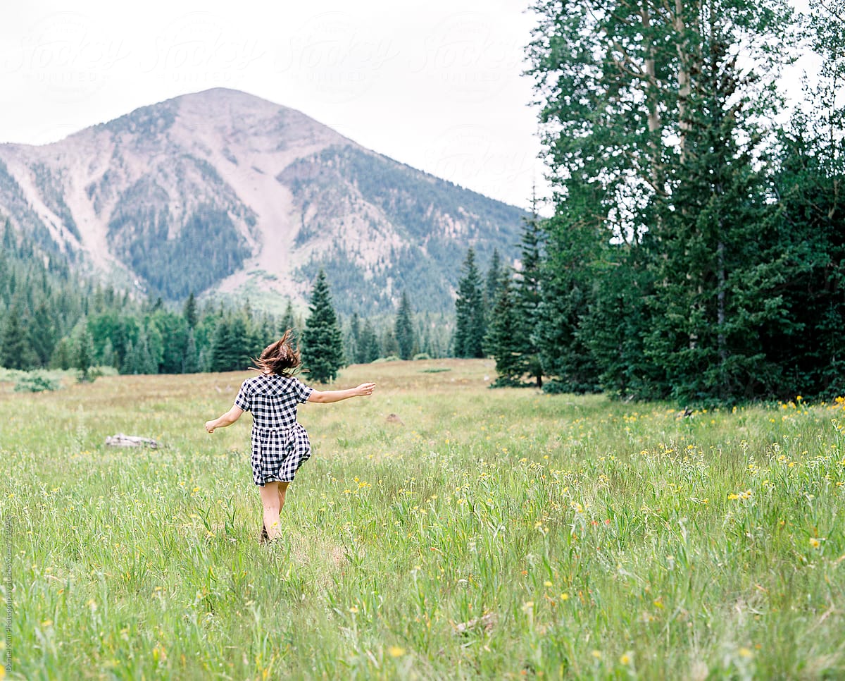 "Woman Jumping In Meadow" by Stocksy Contributor "Daniel Kim ...