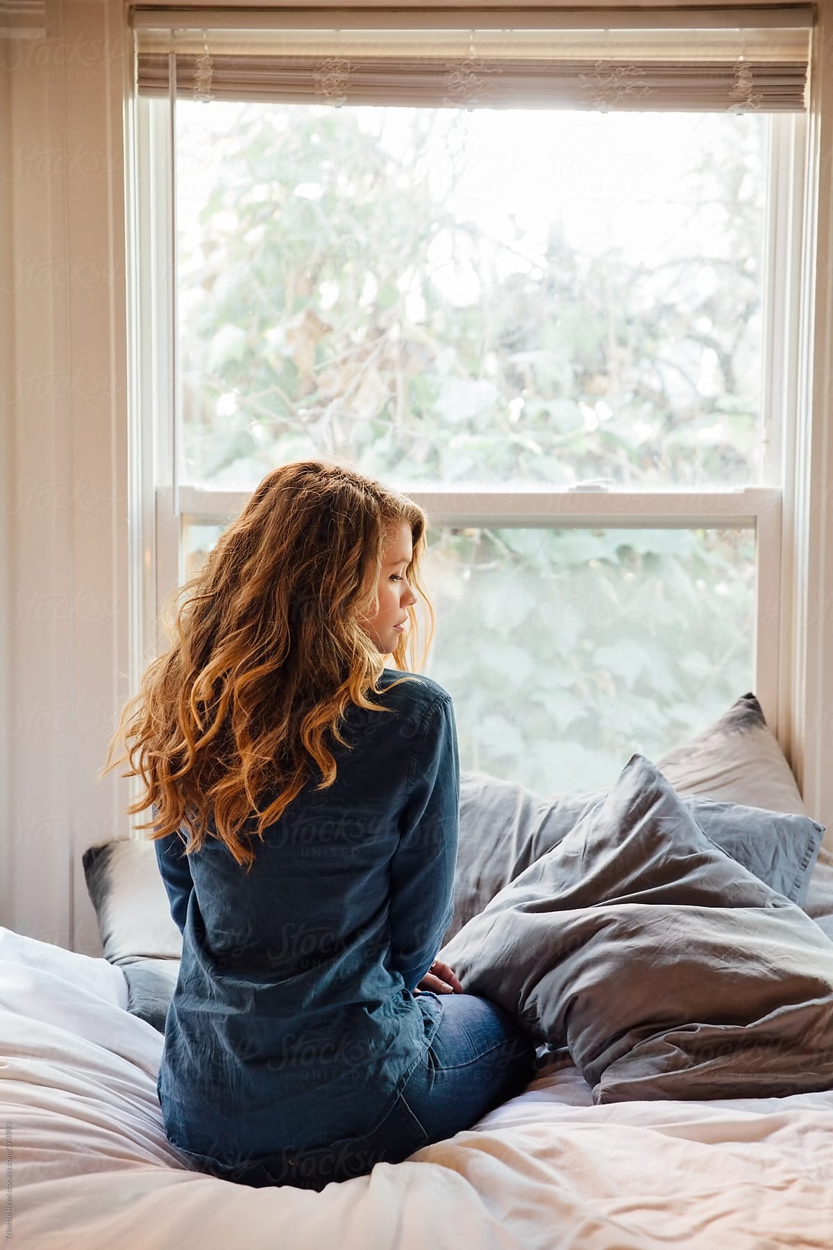 "Woman Relaxing On Bed In Her Bedroom" by Stocksy Contributor "Trinette ...