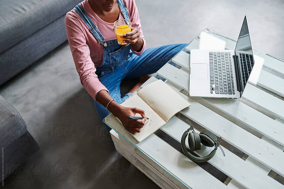 "Woman Writing Notes At Her Coffee Table" by Stocksy Contributor "Ivan ...