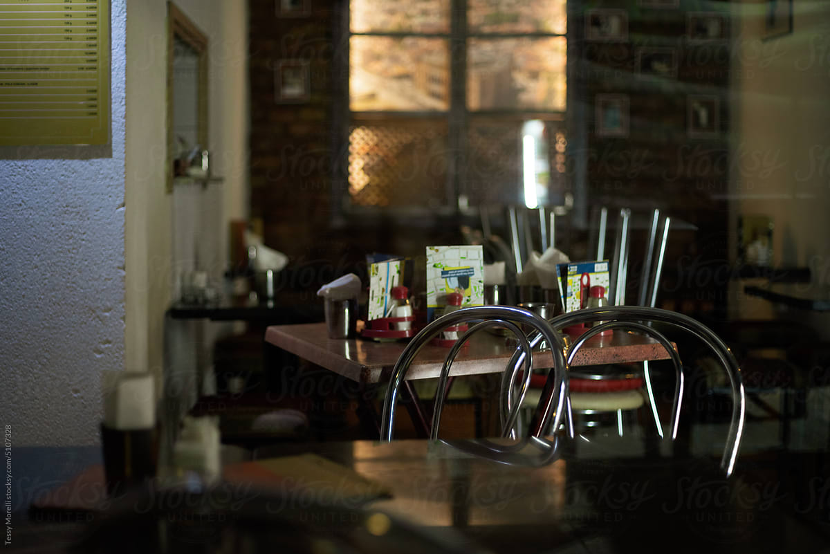 "Dim Light In The Closed Restaurant With Tables At Night" by Stocksy ...