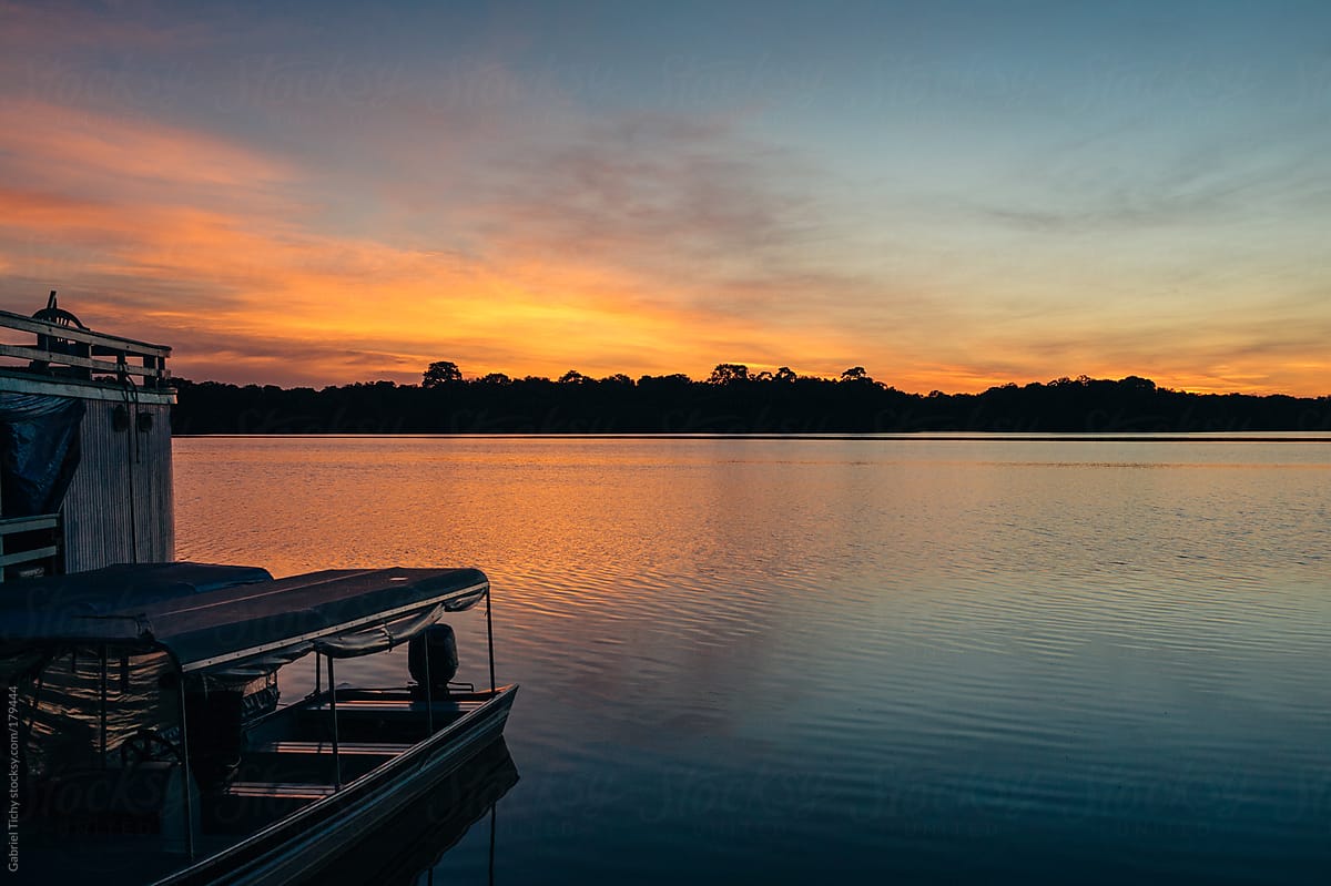 "Boats In Beautiful Sunrise" by Stocksy Contributor "Gabriel Tichy ...