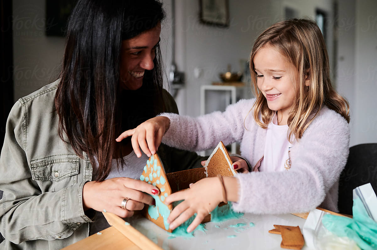 "Mom Making A Gingerbread House With Her Daughter" by Stocksy ...