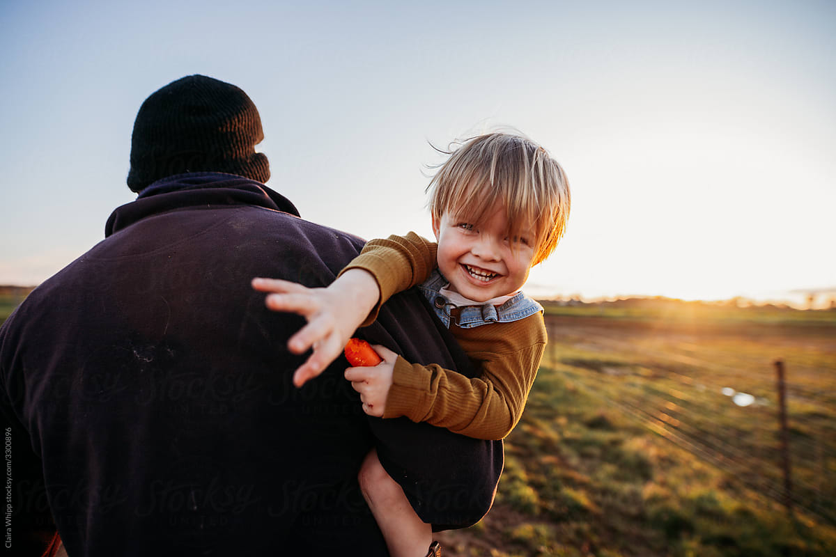 "Boy Reaching Over Mans Shoulder" by Stocksy Contributor "Claira Whipp ...