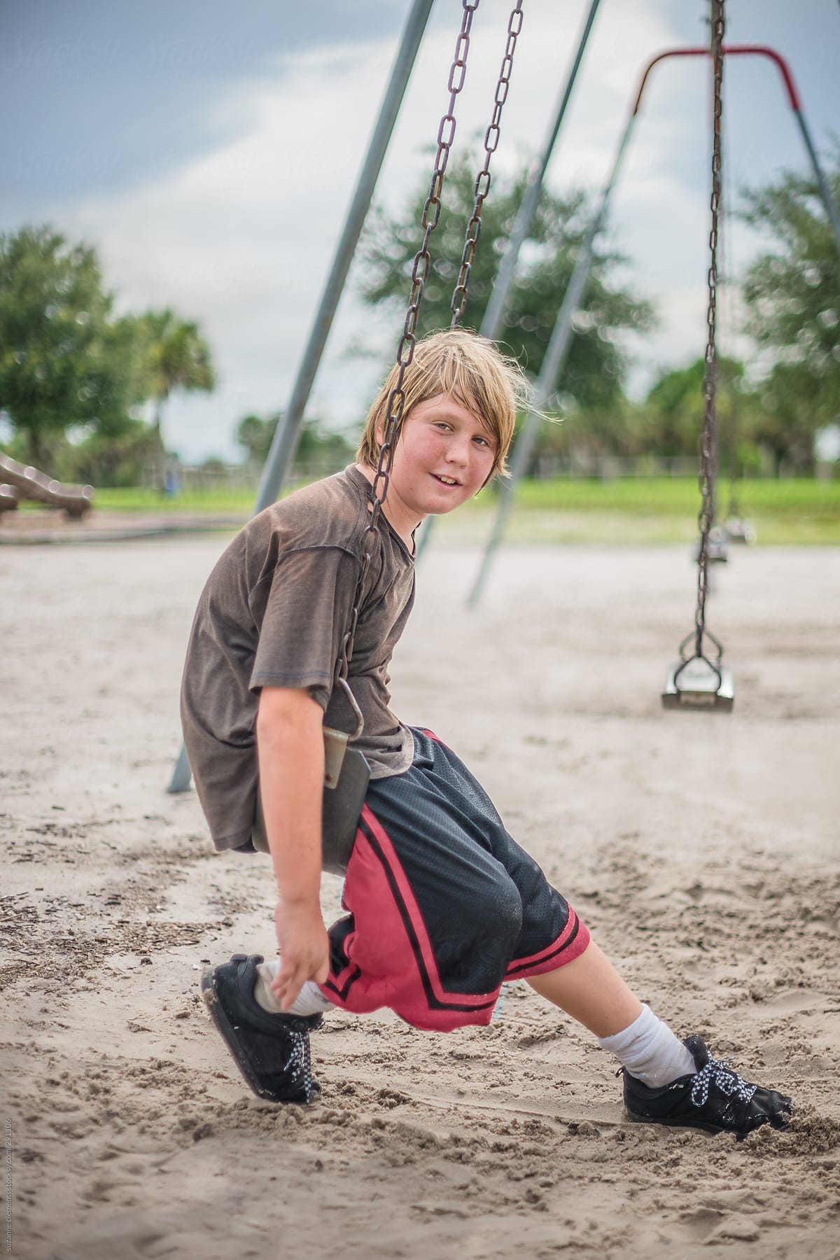 "Portrait Of A Teenager On A Chain Link Swing" by Stocksy Contributor ...