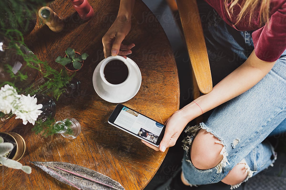 "Woman Reading From Her Cell Phone" by Stocksy Contributor "Lumina ...