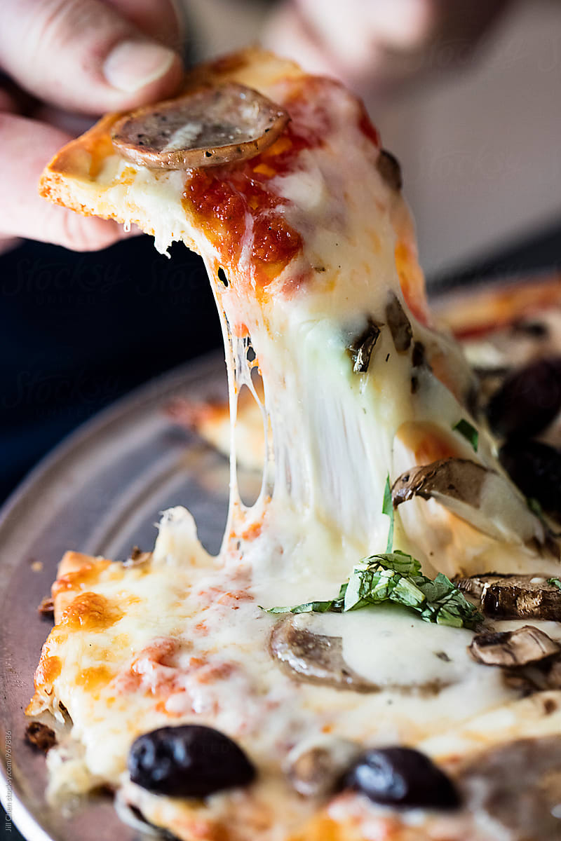 "Pizza With Loads Of Cheese" by Stocksy Contributor "Jill Chen" - Stocksy