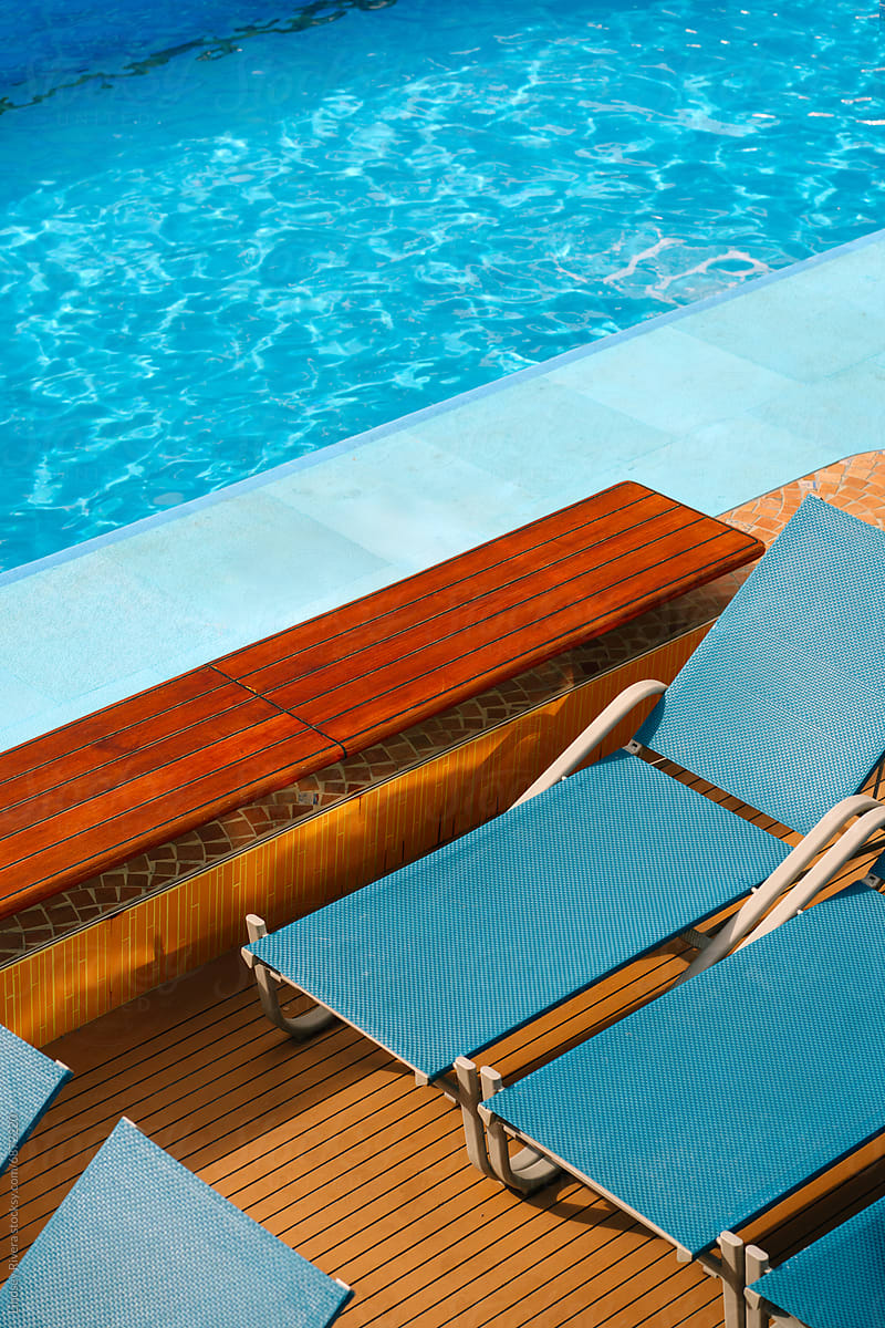 "Colorful Lounge Chairs Beside Swimming Pool" by Stocksy Contributor ...