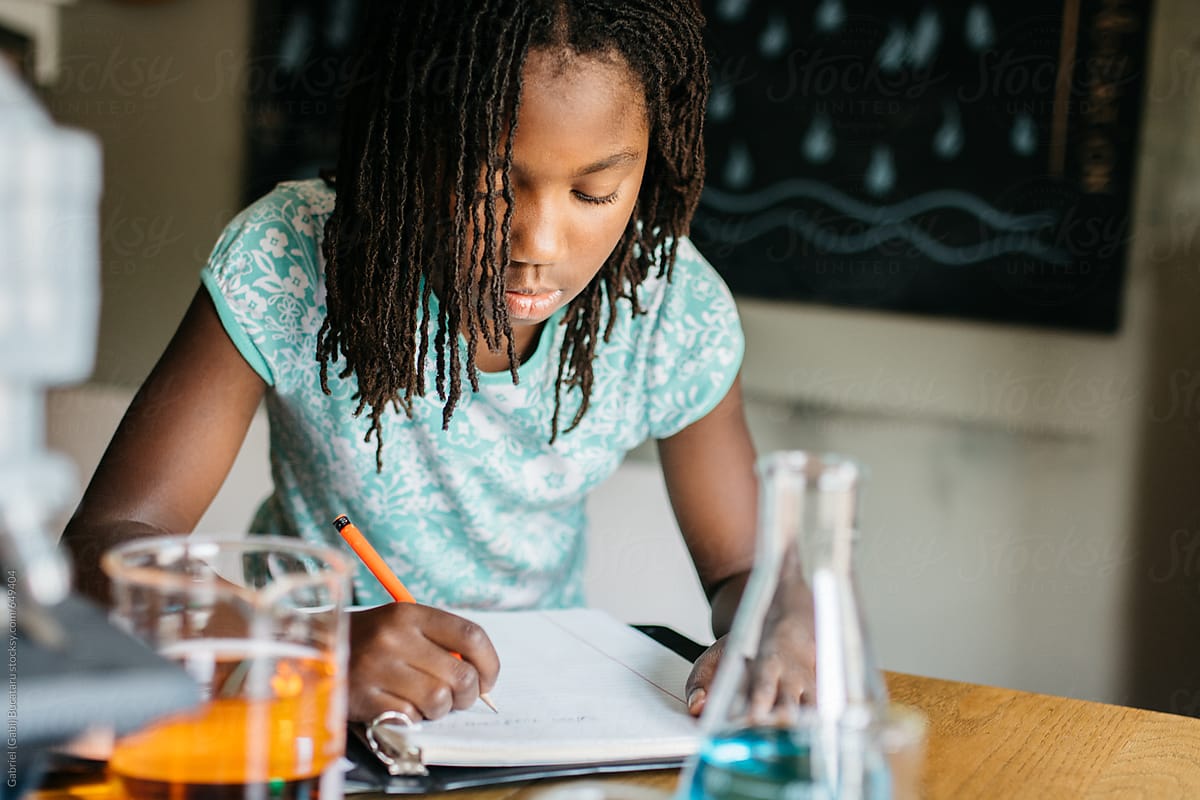 "African American Girl Taking Notes In A Science Class" by Stocksy ...