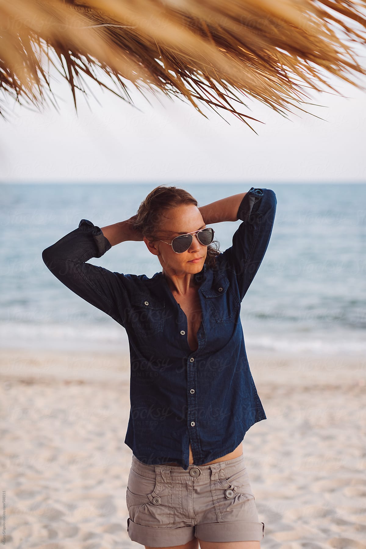 "Woman Arrived At The Beach" by Stocksy Contributor "Mauro Grigollo ...