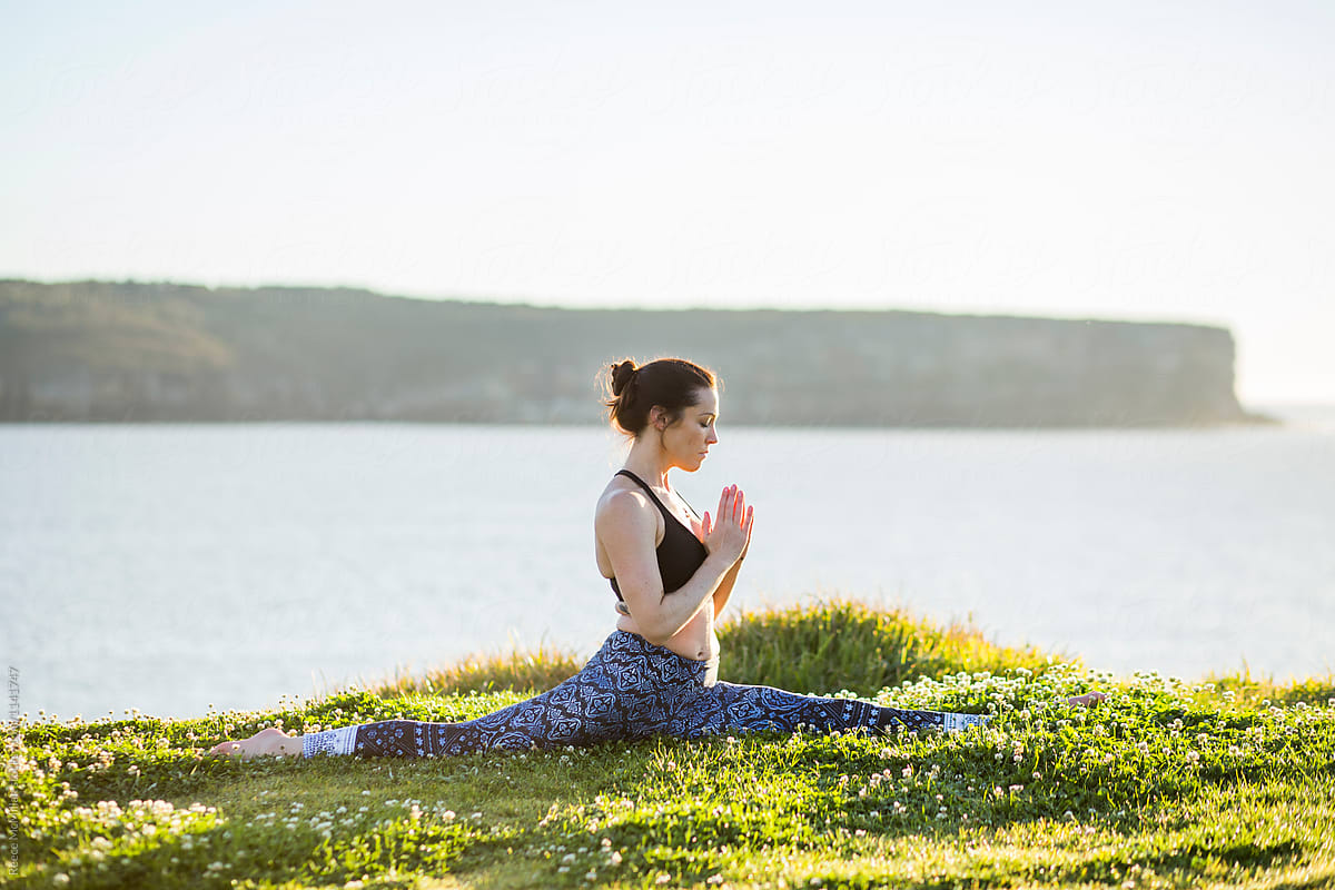 "A Female Yogi Practicing At Sunrise" by Stocksy Contributor "Reece ...