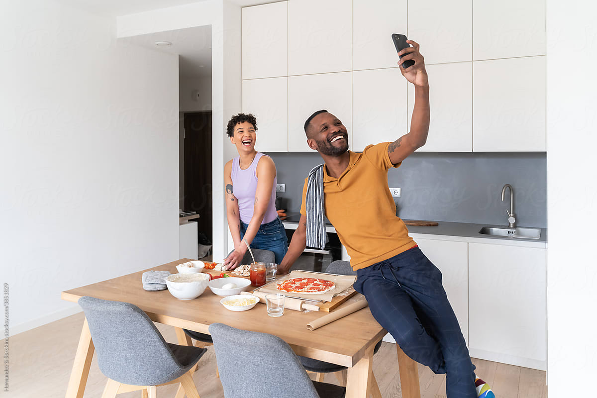 "Couple Taking Selfie While Cooking" by Stocksy Contributor "Hernandez ...