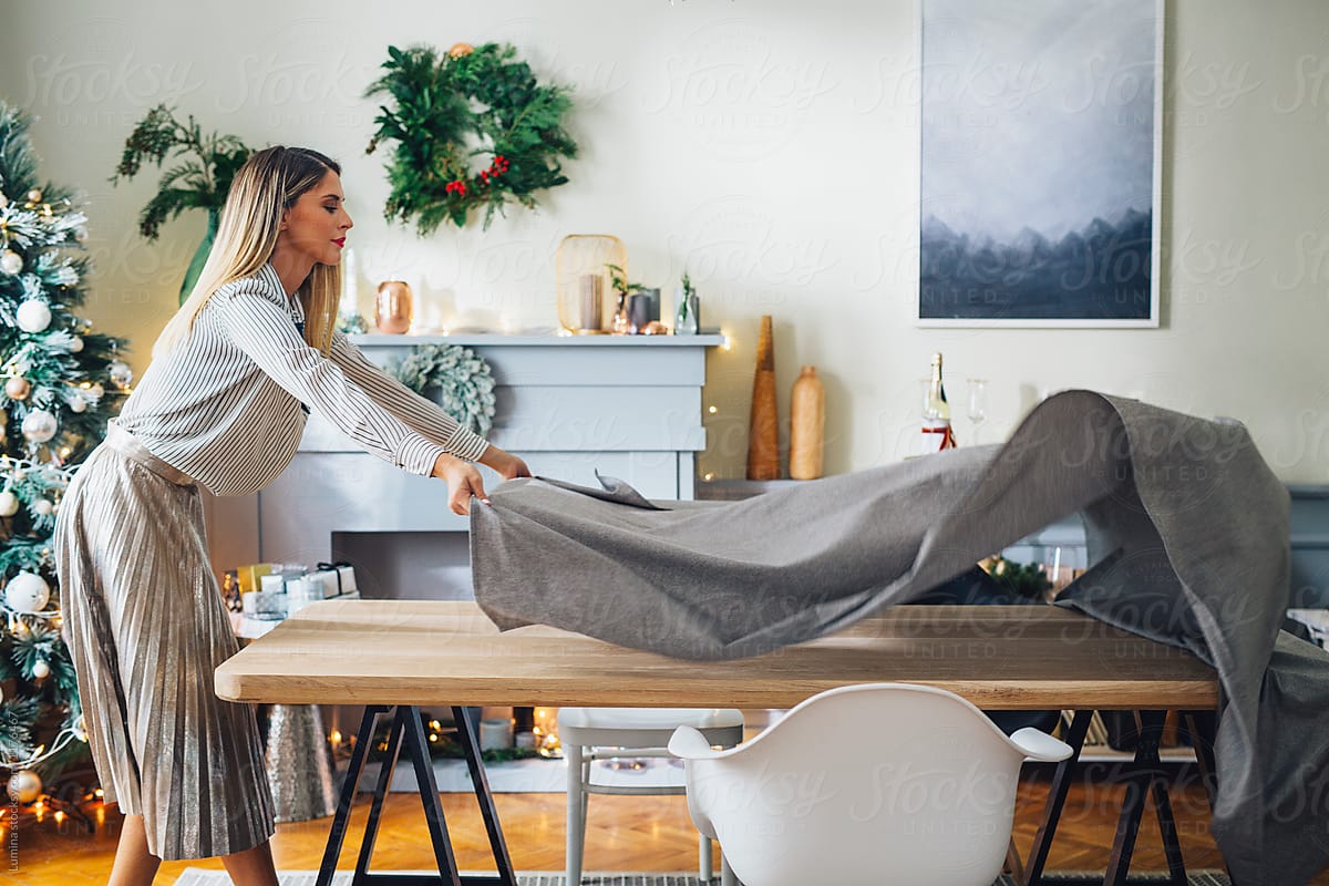 Woman Putting Table Cloth By Stocksy Contributor Lumina Stocksy Woman Putting Table Cloth By Stocksy Contributor Lumina Stocksy