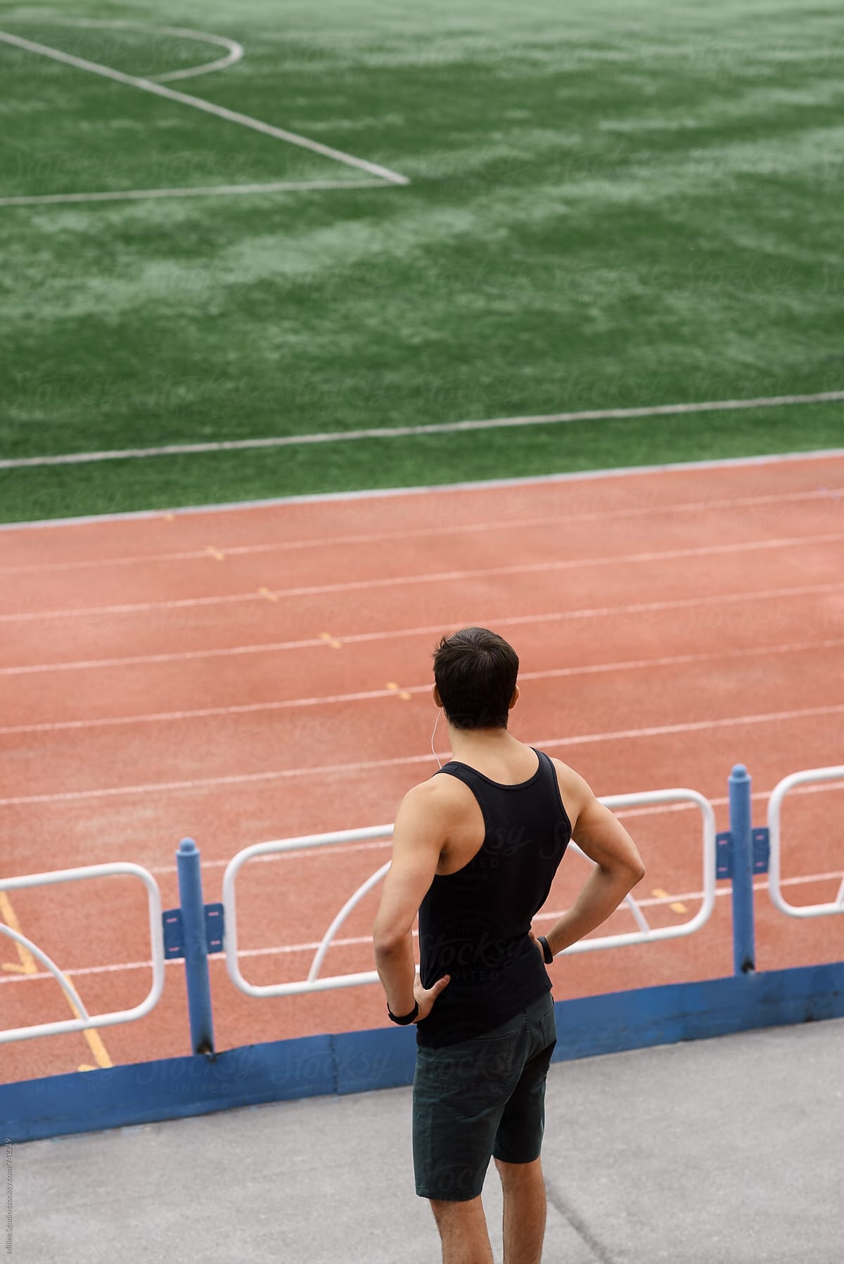 "Man Standing On Stand At Stadium" by Stocksy Contributor "Milles Team ...