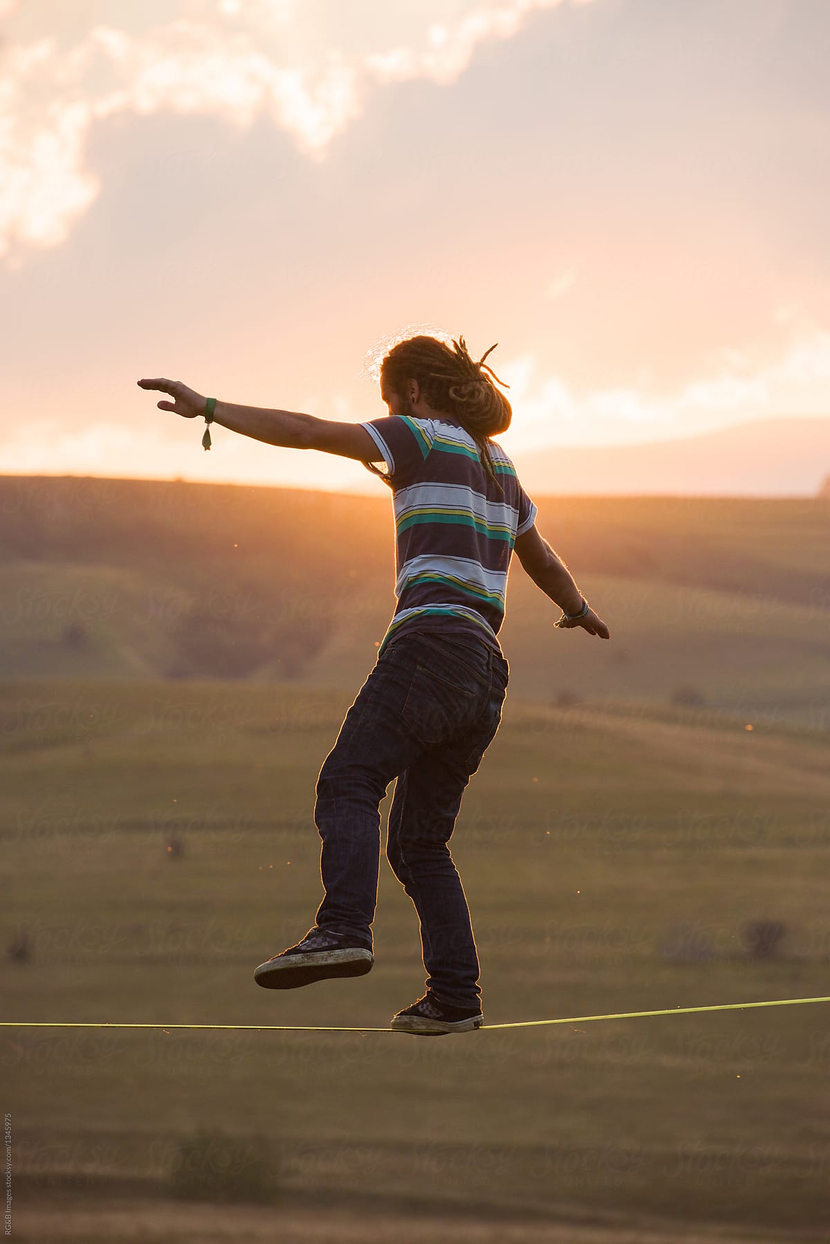 "Young Man Standing In One Foot On Slackline" by Stocksy Contributor ...