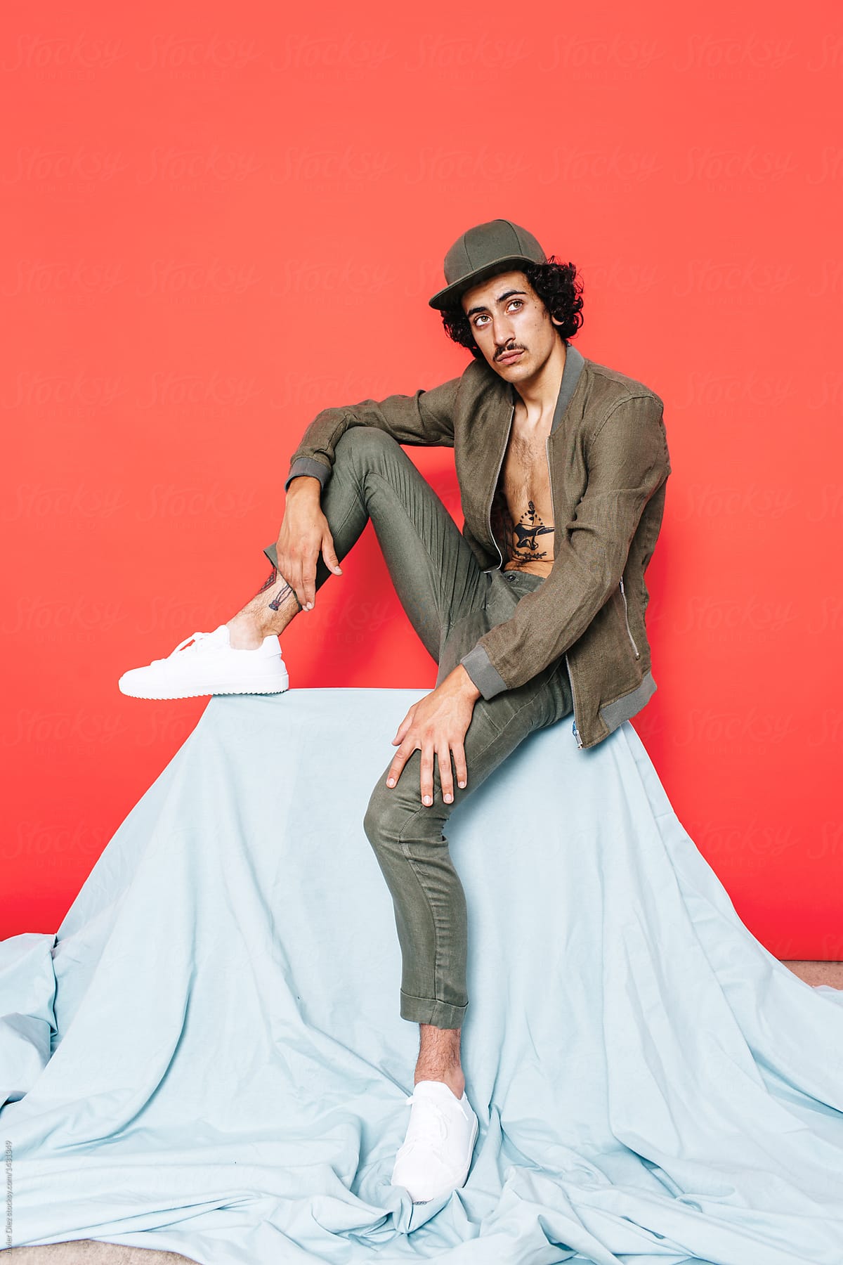 "Stylish Man Posing In Studio" by Stocksy Contributor "Javier Díez ...