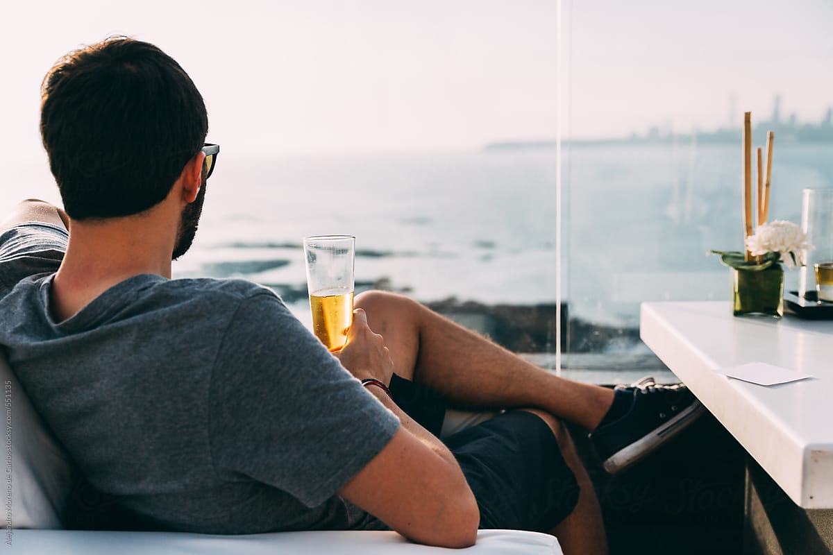"Young Man Having A Beer On A Lounge Cafe Bar On The Rooftop Of A City ...