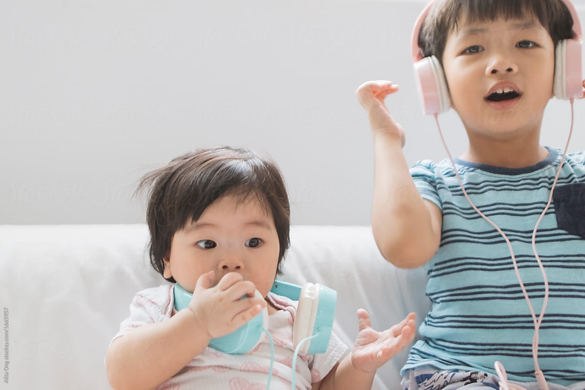 "Kiddo Wearing Headphone" by Stocksy Contributor "Alita ." - Stocksy