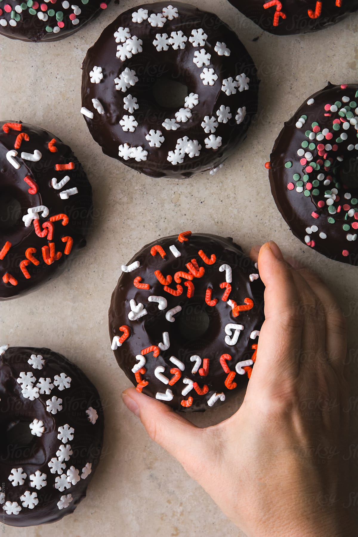 "Hand Grabbing Chocolate Donut" by Stocksy Contributor "Sibila and ...