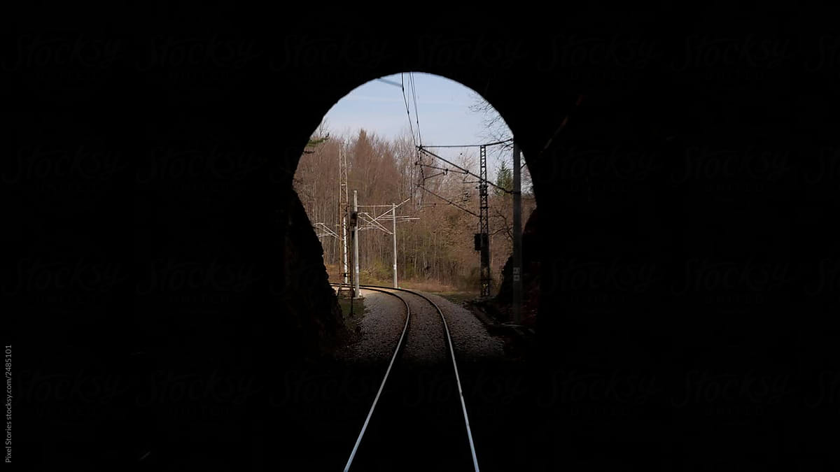 "Train Exiting Tunnel" by Stocksy Contributor "Sibila and Pavel" - Stocksy