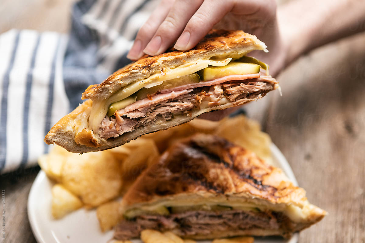 "Hand Holding Delicious Traditional Cuban Pressed Sandwich" by Stocksy ...