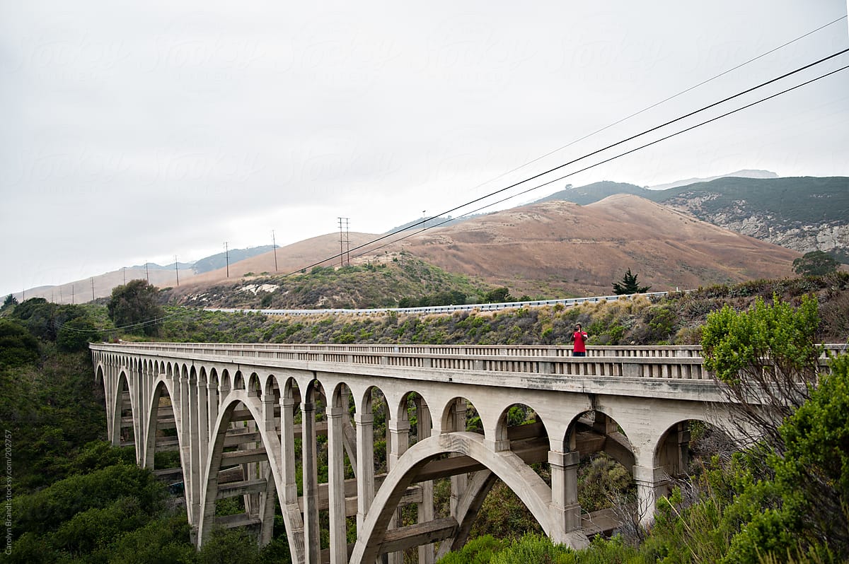 "Man Takes Photo From A Bridge" by Stocksy Contributor "Carolyn Brandt ...