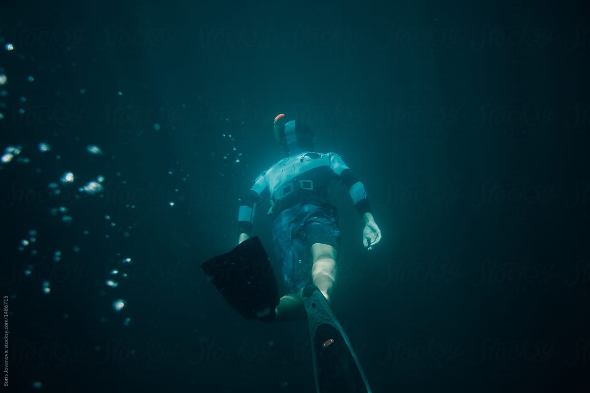 "Man Diving In The Sea" by Stocksy Contributor "Boris Jovanovic" - Stocksy