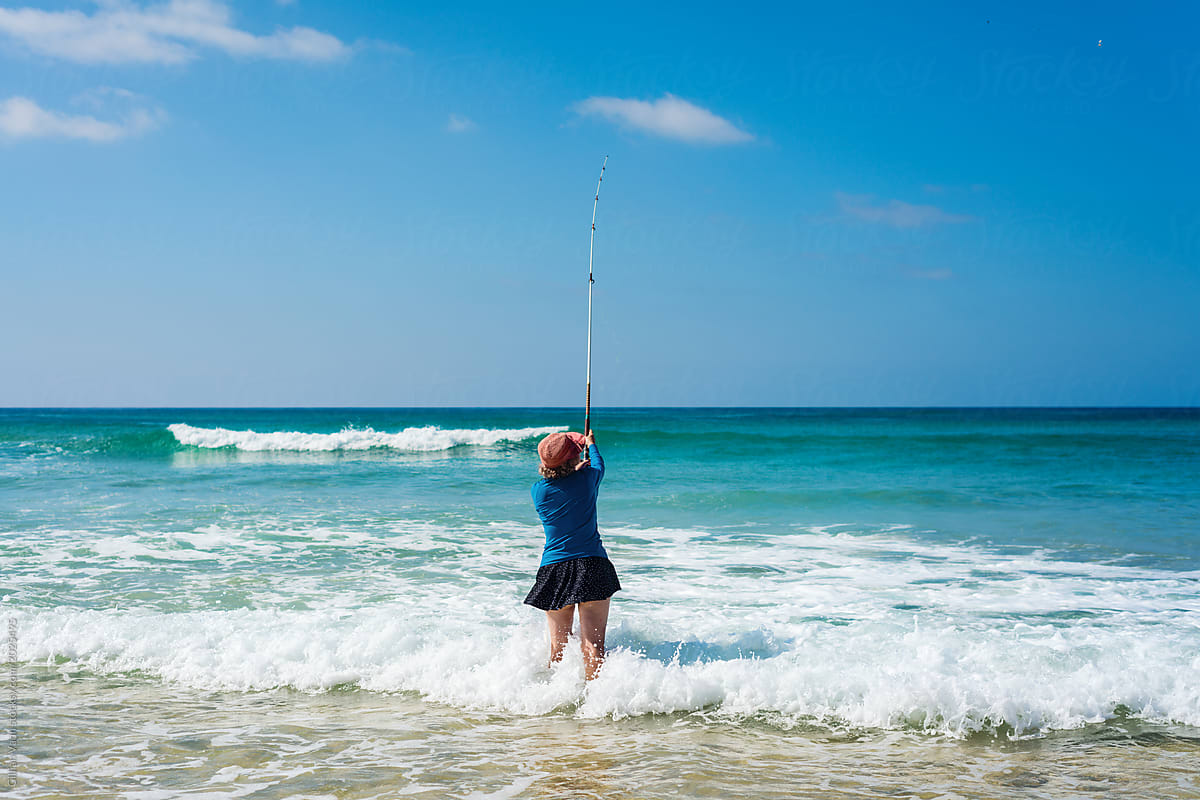 "Fishing At The Beach" by Stocksy Contributor "Gillian Vann" - Stocksy
