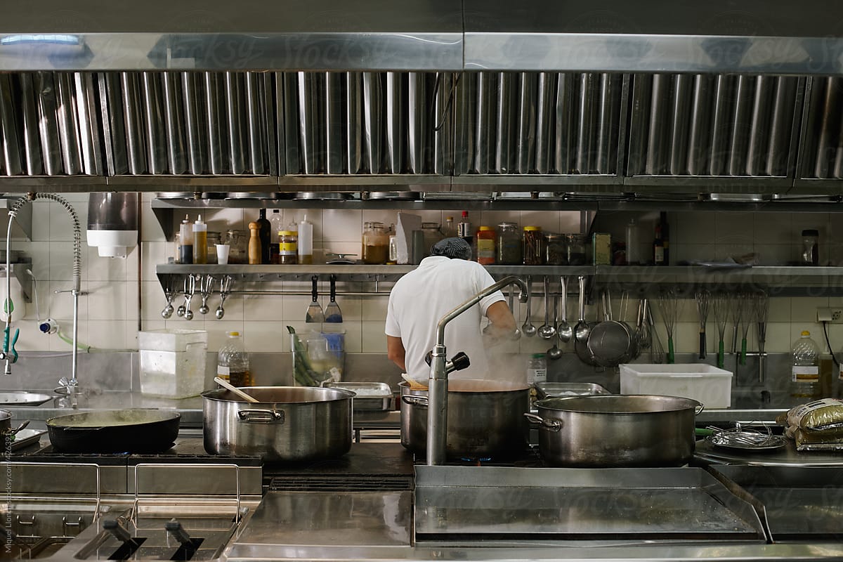 "Restaurant Kitchen And Cook At Work" by Stocksy Contributor "Miquel ...