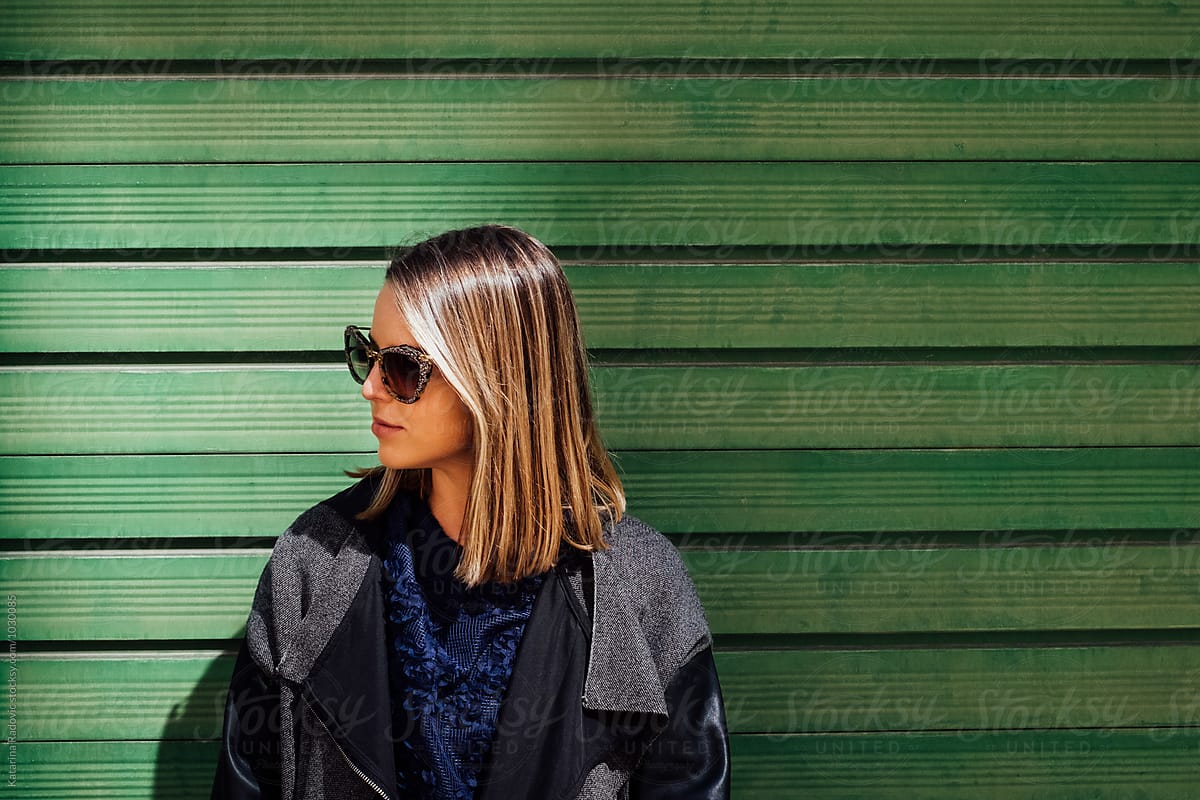 "Portrait Of A Woman In Front Of The Green Wall" by Stocksy Contributor ...